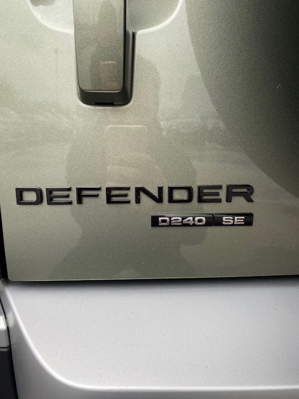 Land Rover Defender Rear Badge - Gloss Black – Stratstone Shop